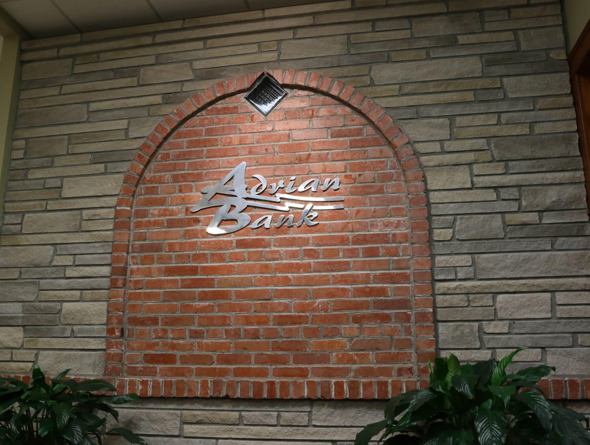 Silver Bank Sign on Bricks - Adrian Bank